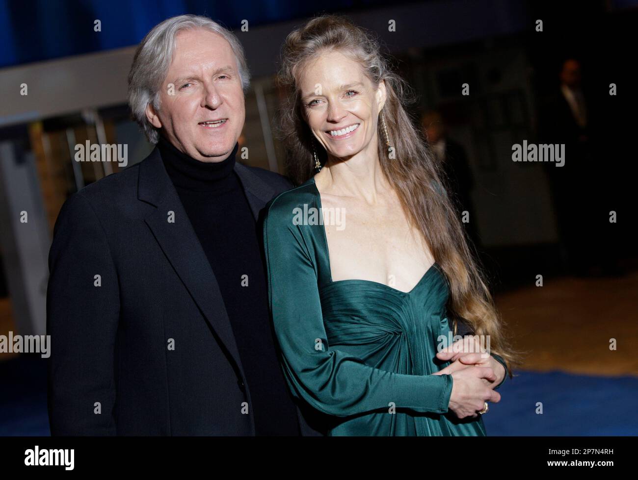 Canadian born director James Cameron, left, arrives for the World ...