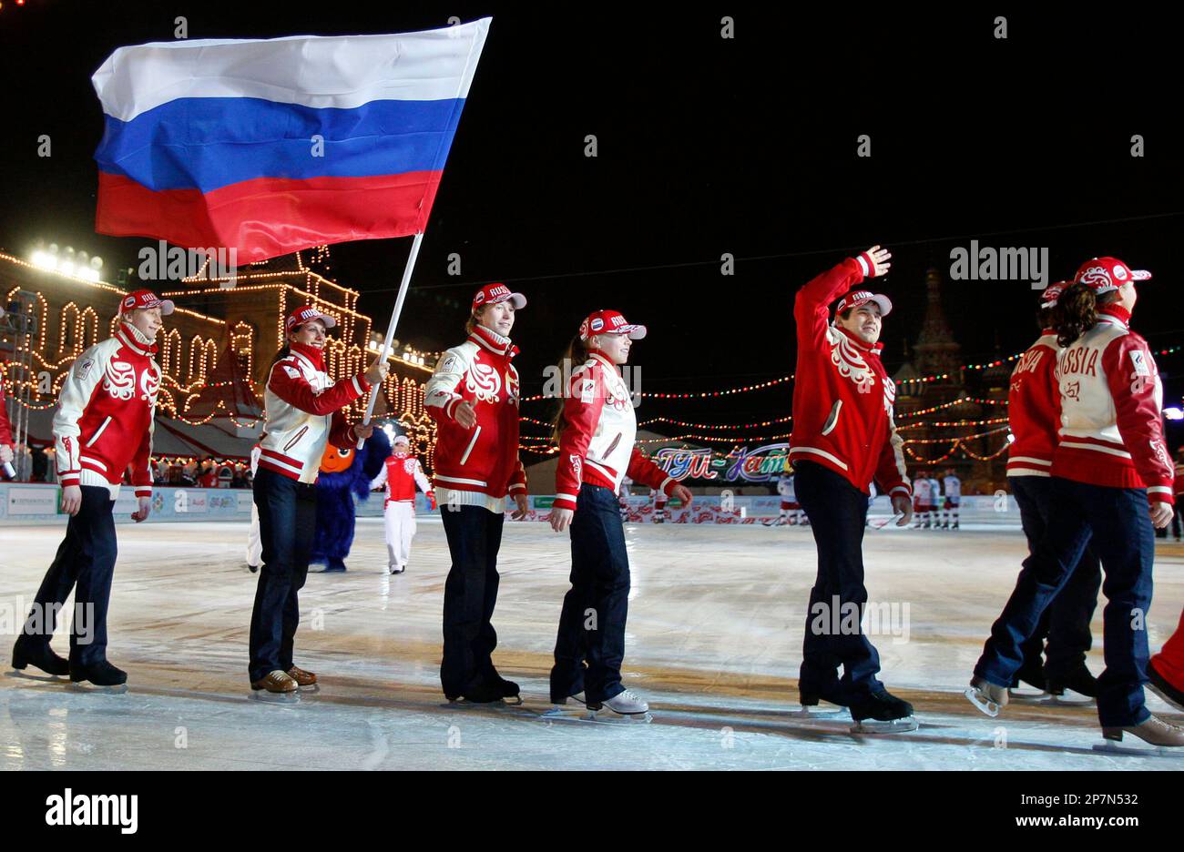 Russia sportsmen holding a Russian flag display the national team's new ...