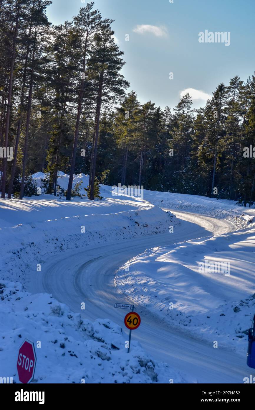 View of a slippery winter road on the Swedish country side, snow and ...