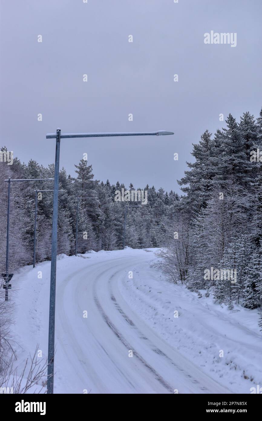 View of a slippery winter road on the Swedish country side, snow and ...