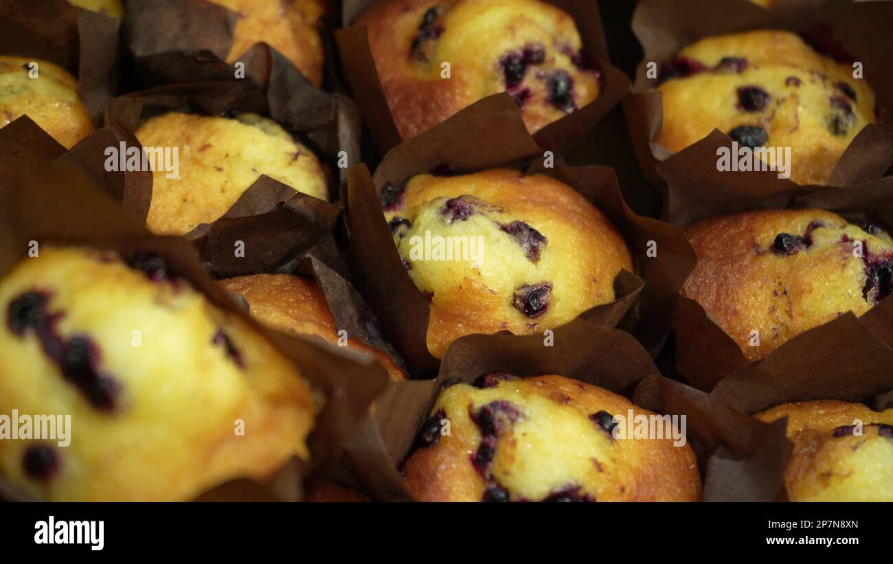 Freshly baked healthy muffins on the counter in the store. Shopping at ...