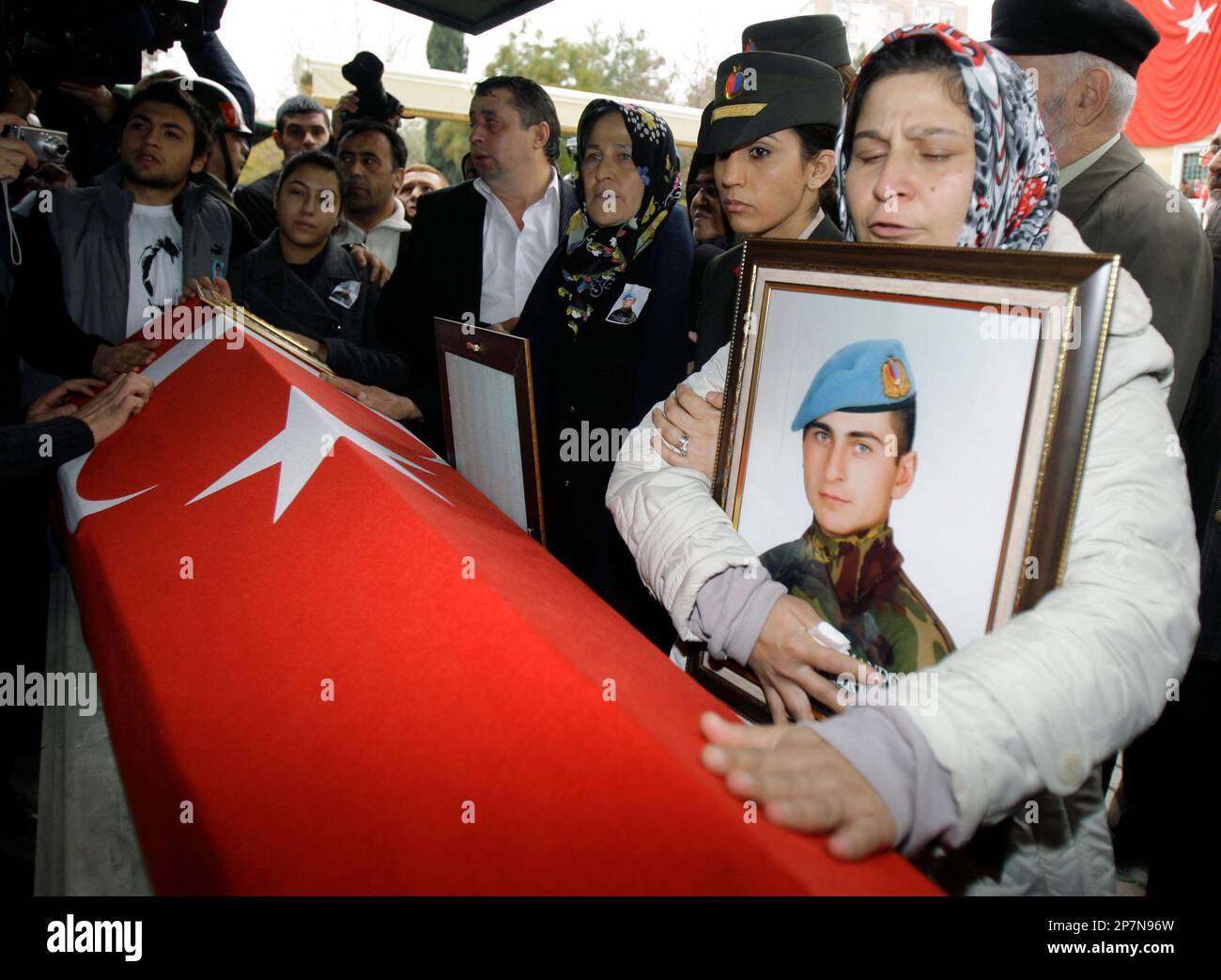 A relatine mourns as thousands of Turks, including army officers ...