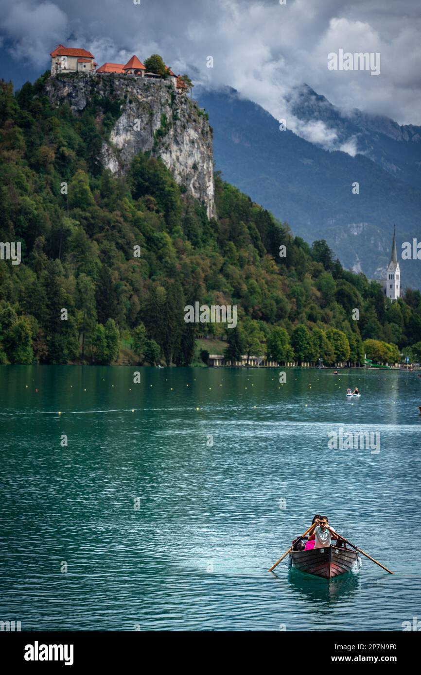Bled, Slovenia - Aug 28 2022: Young couple rowing a rent boat on Lake ...