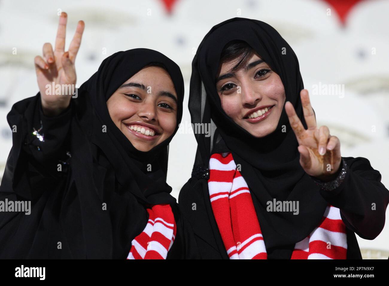 Emirates soccer fans gesture, as they wait for the start of the Club ...