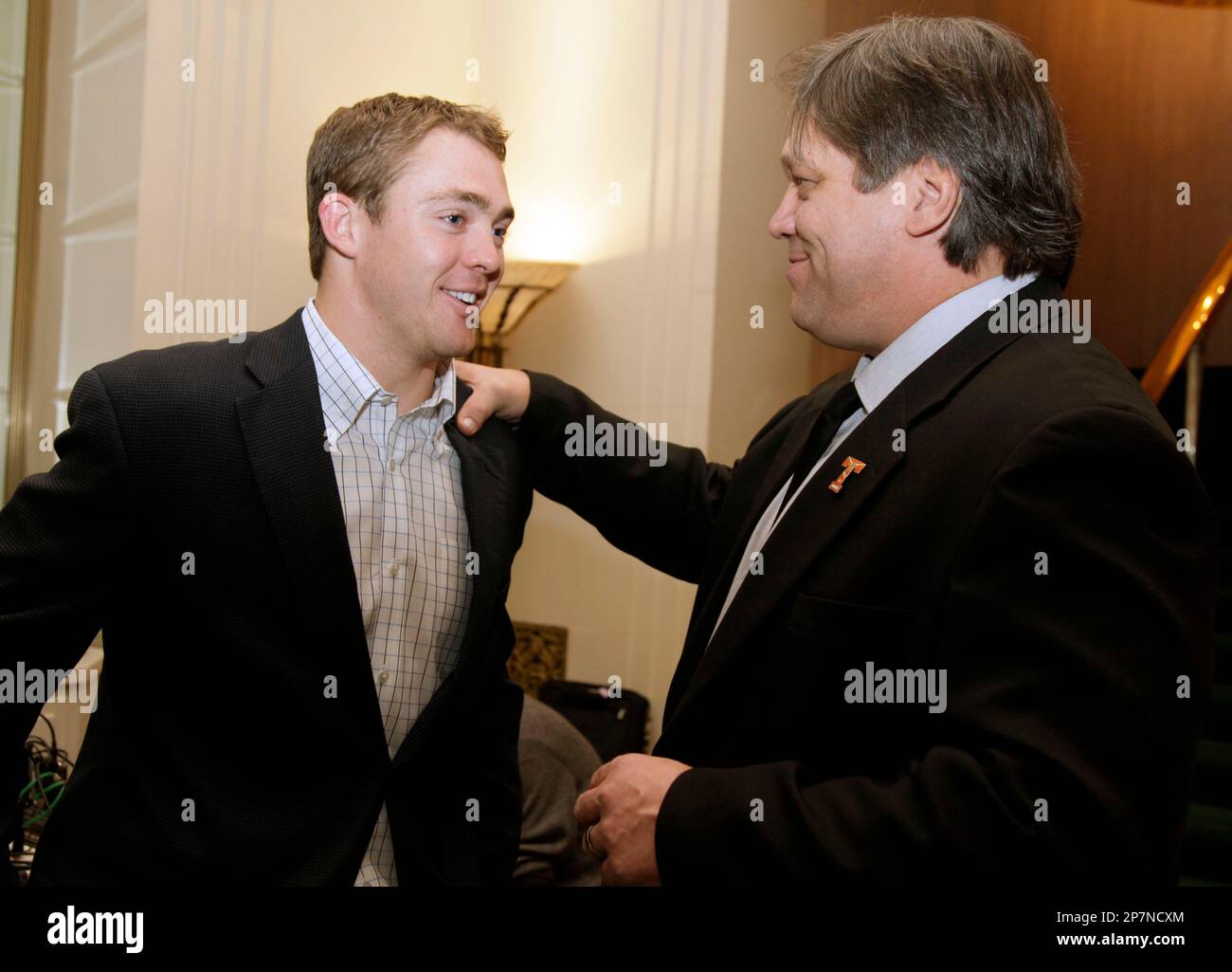 Texas quarterback Colt McCoy, left, talks with Steve McMichael, former ...