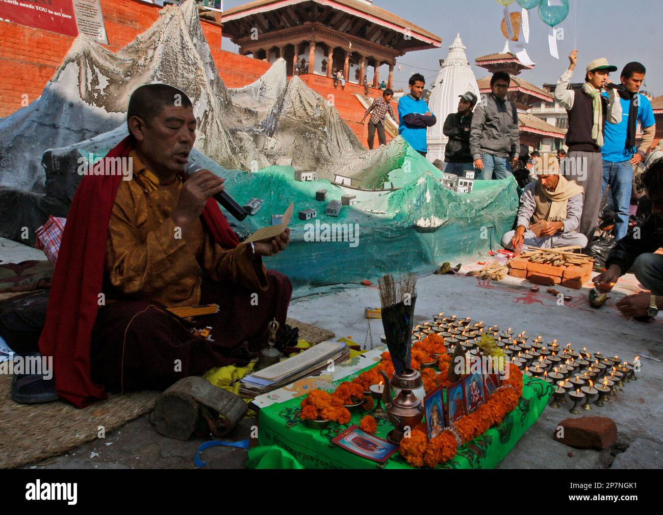 A Nepalese Buddhist monk performs religious rituals to pray for the ...