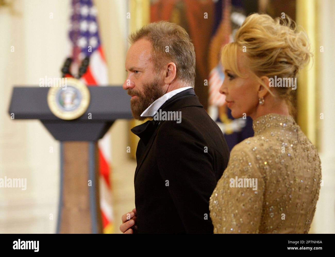 Sting, left, and his wife Trudie Stylier look for their seats at the event with President Barack ...