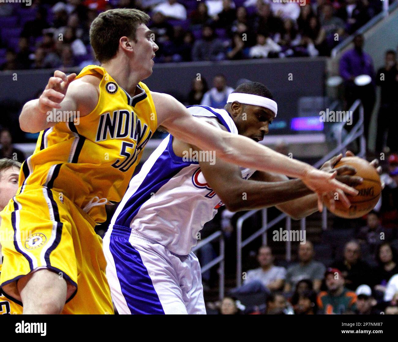 Los Angeles Clippers forward Craig Smith, right, grabs a rebound away ...