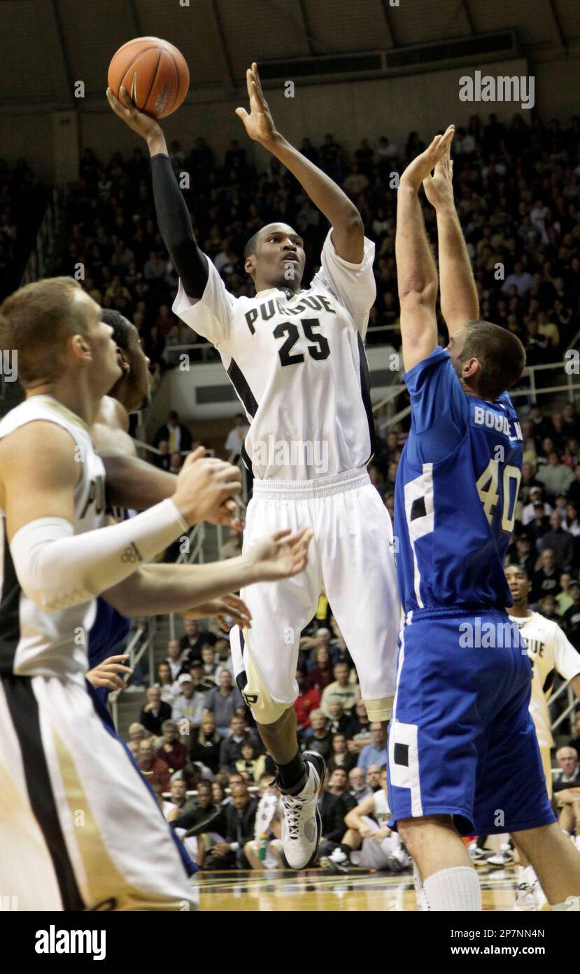 Purdue forward JaJuan Johnson, left, shoots over Buffalo forward Max ...