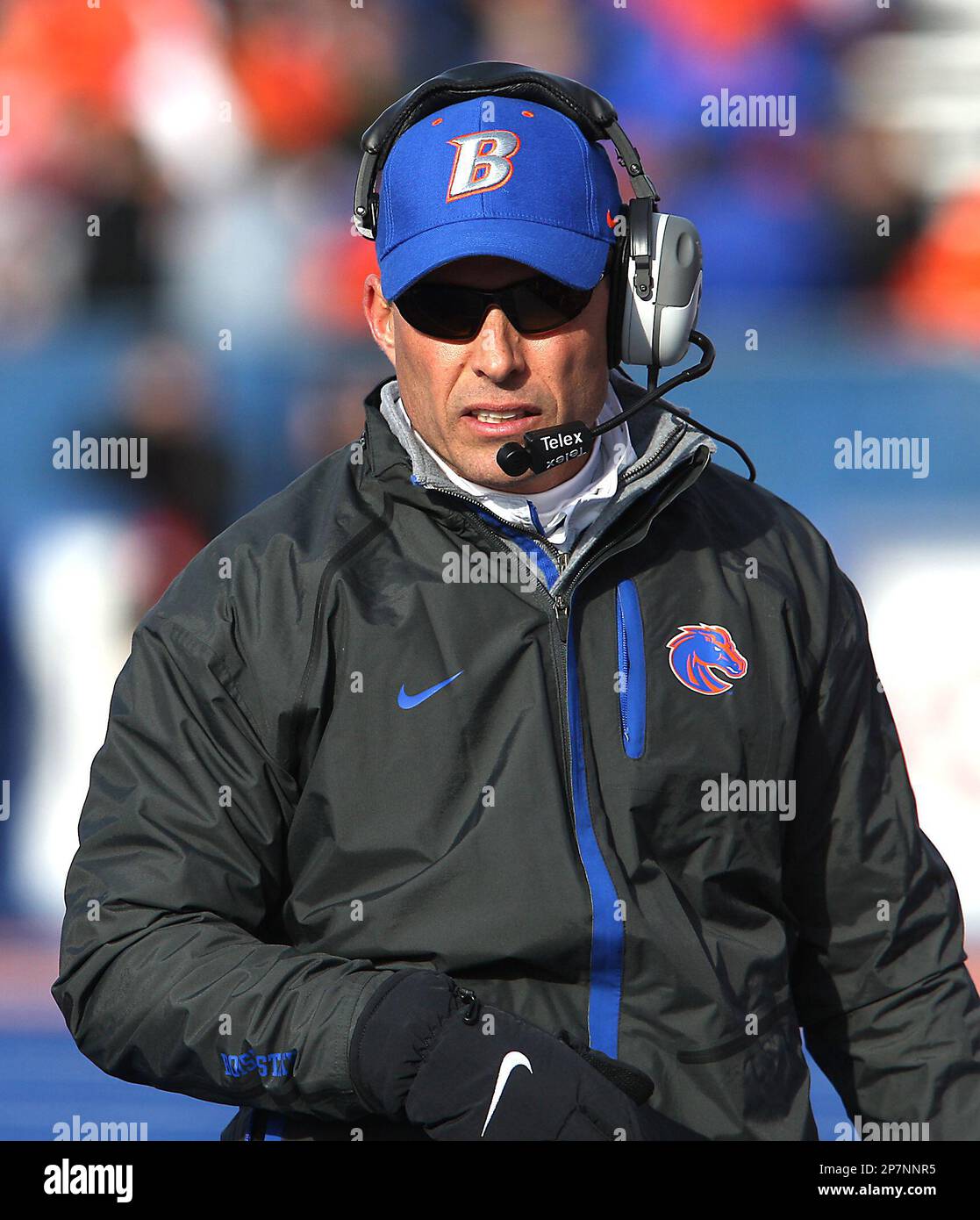 Boise State head coach Chris Petersen walks the sidelines while playing ...