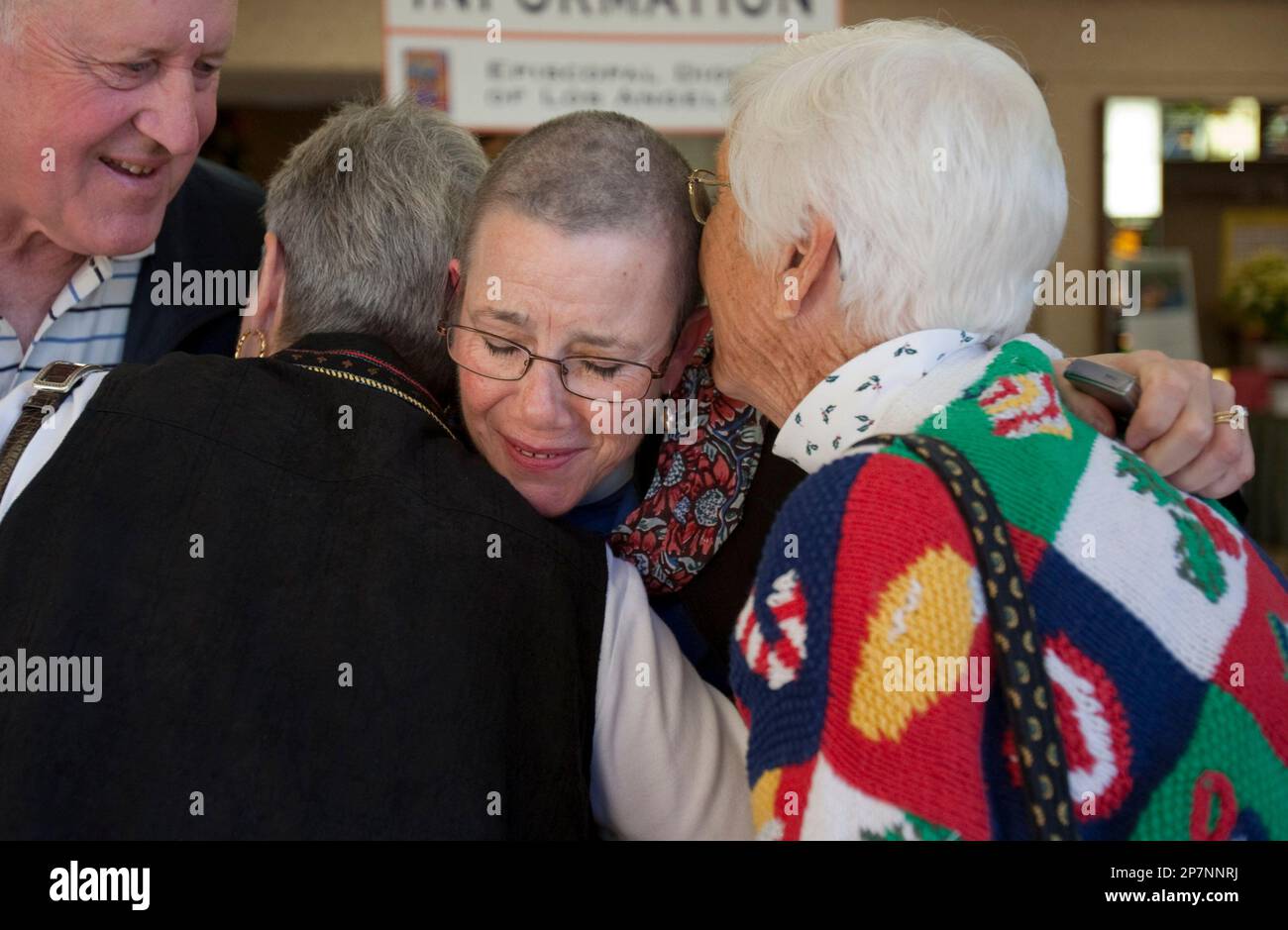 Rev. Diane M. Jardine Bruce, second from right, gets a hug from J.R ...
