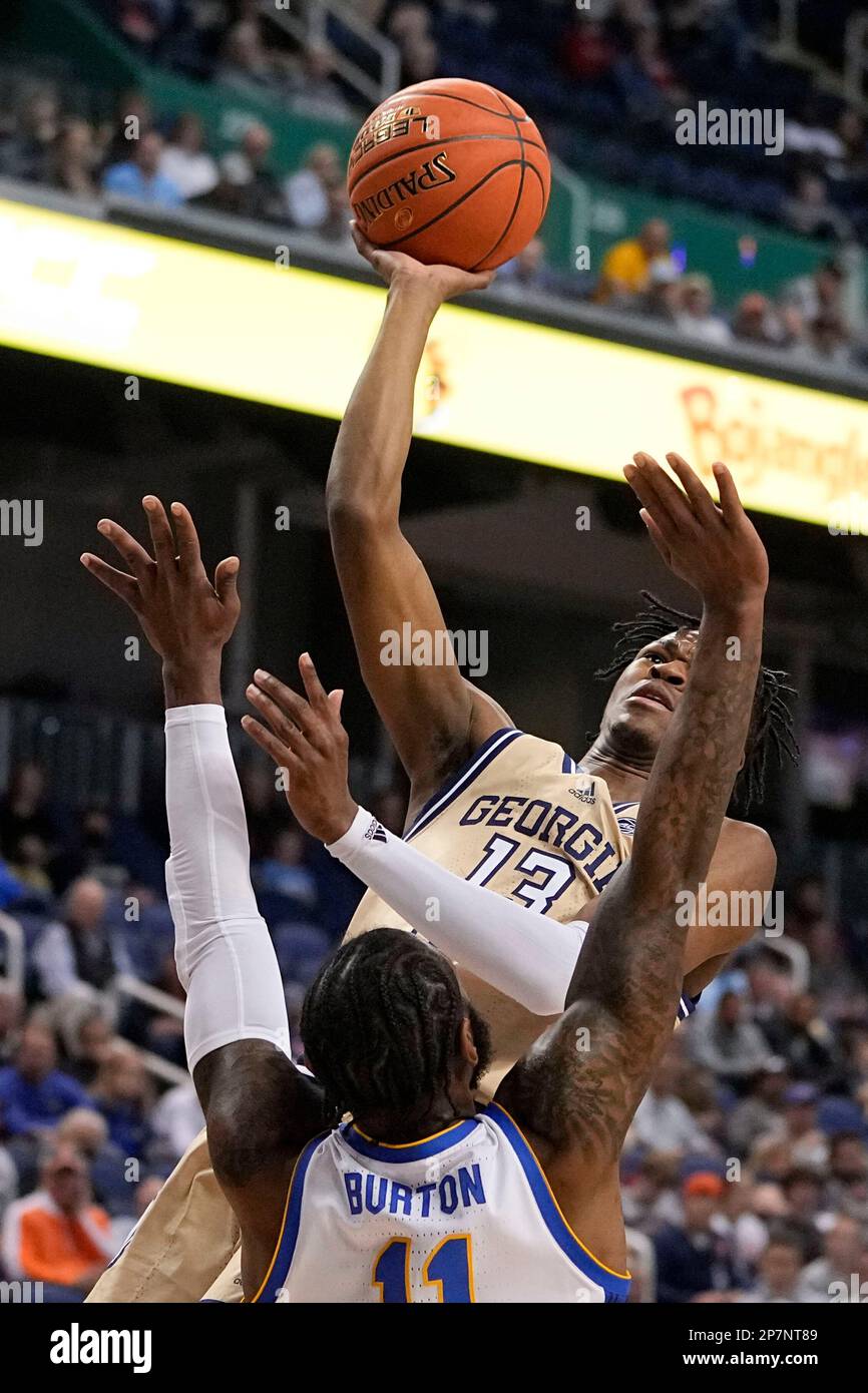 Georgia Tech guard Miles Kelly shoots over Pittsburgh guard Jamarius ...