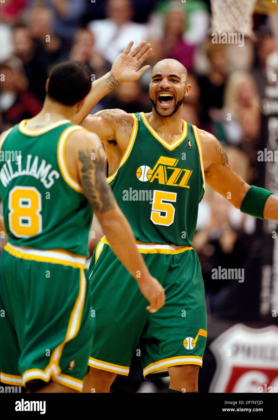 Utah Jazz forward Carlos Boozer (5) celebrates a basket with teammate ...