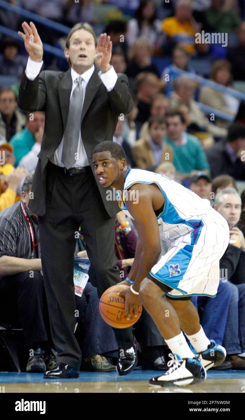 New Orleans Hornets guard Chris Paul, right, picks up the ball as ...