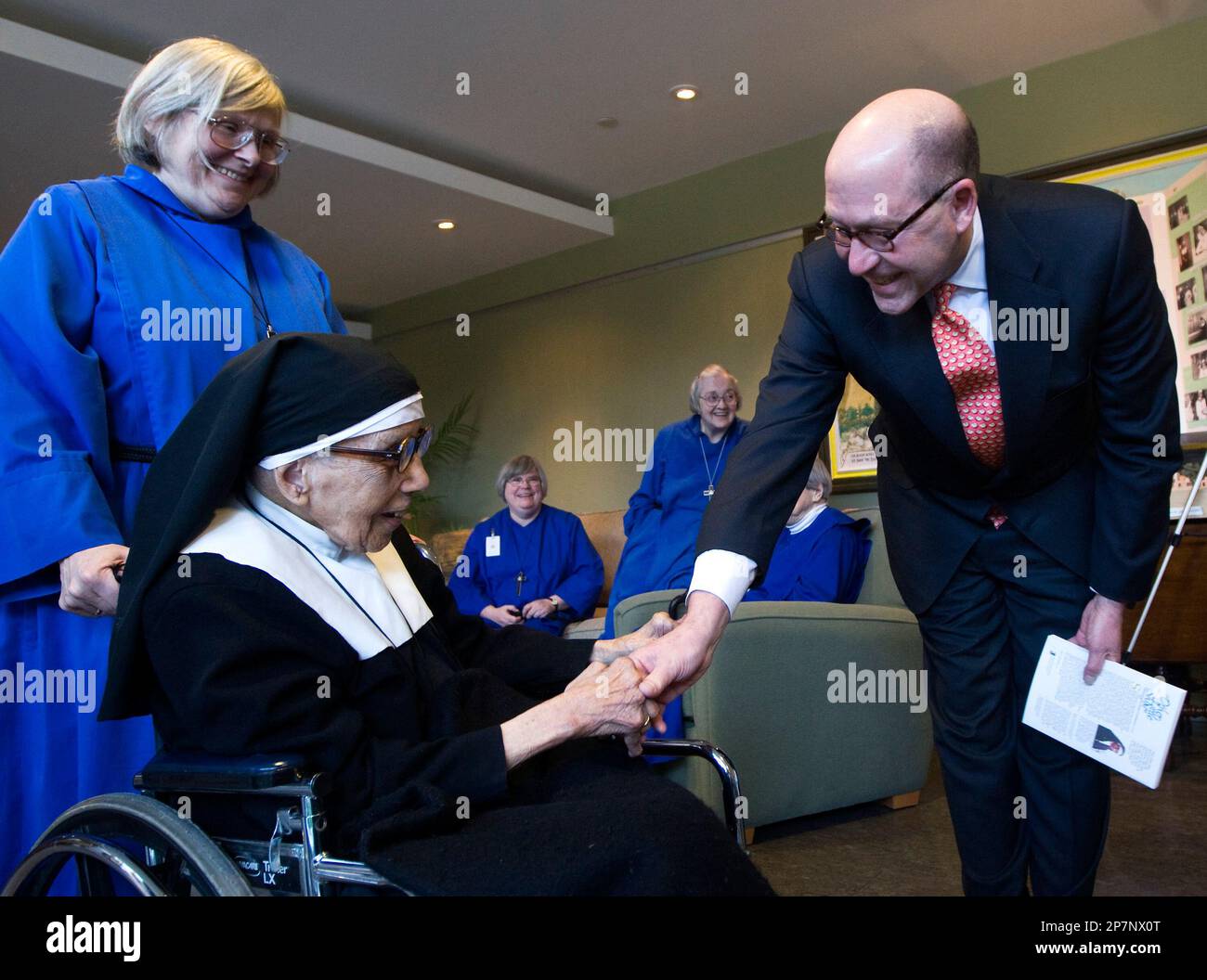 United States Ambassador David Jacobson shakes hands with Sister ...
