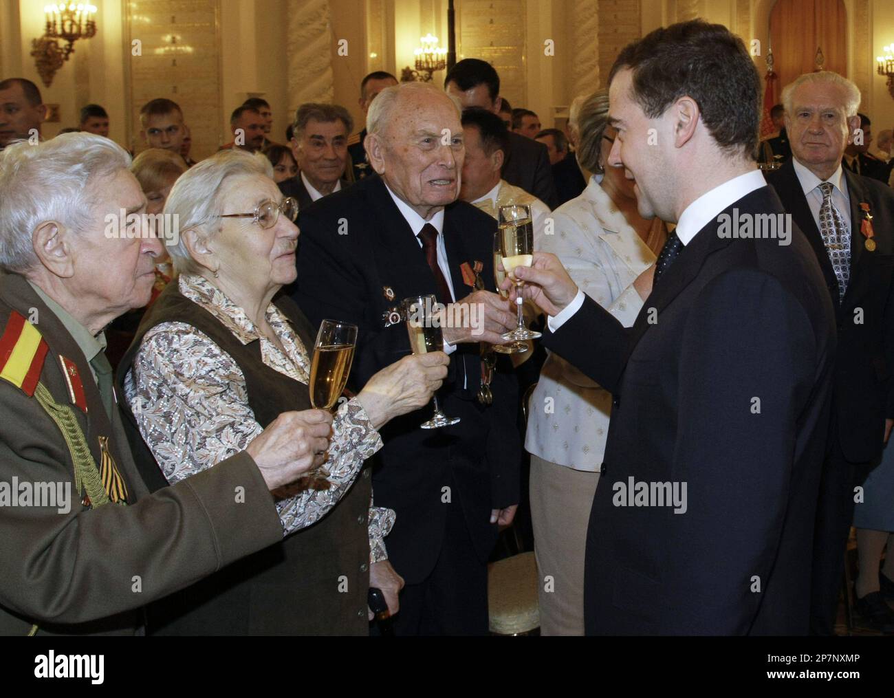 President Dmitry Medvedev, right, toasts Russian World War II veterans ...