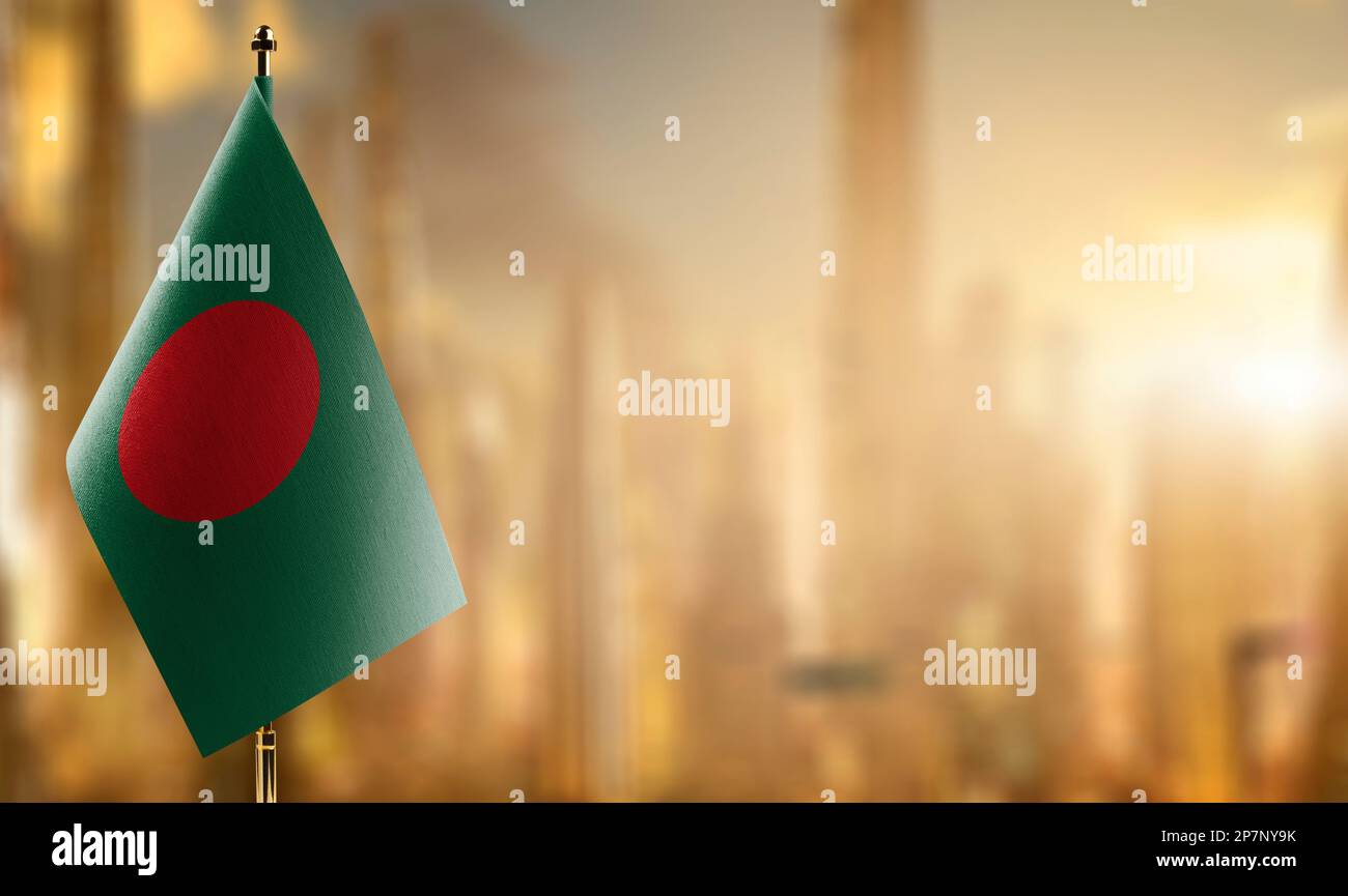 Small flags of the Bangladesh on an abstract blurry background Stock ...