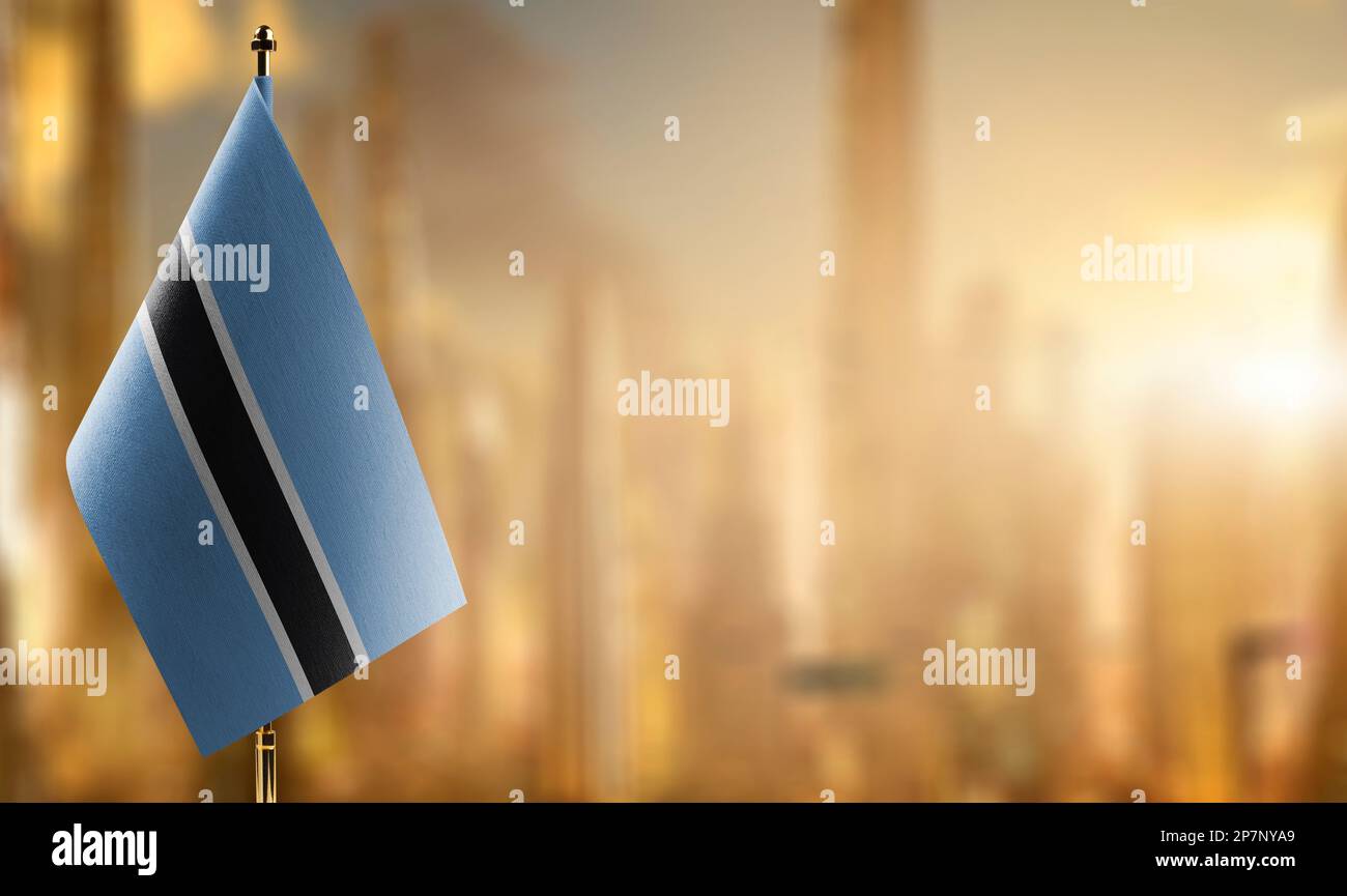 Small flags of the Botswana on an abstract blurry background Stock ...