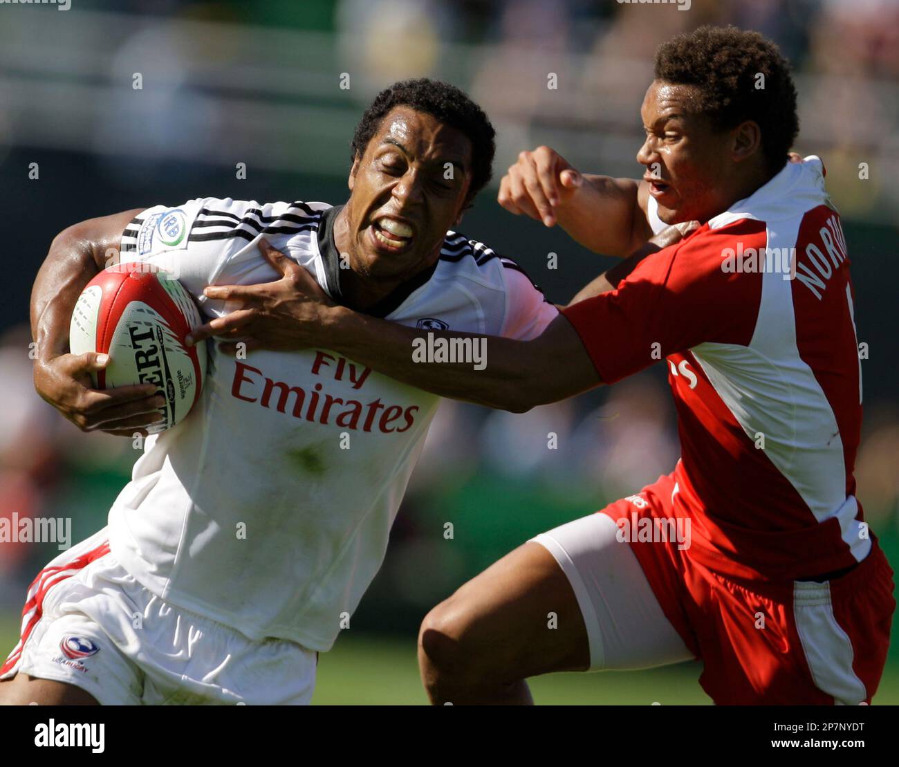England's Dan Norton, right, tries to hold United States Nick Edwards ...