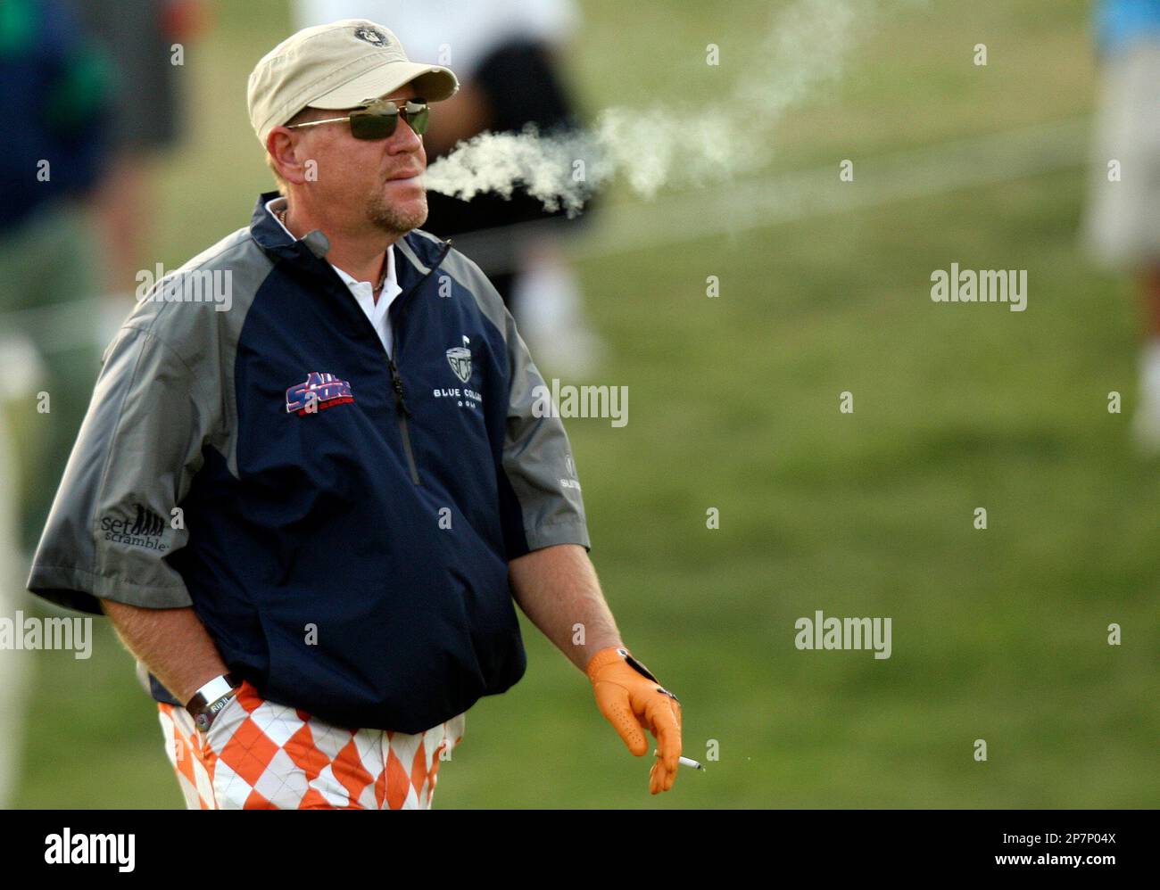 America's John Daly has a smoke as he walks along the 3rd hole in ...