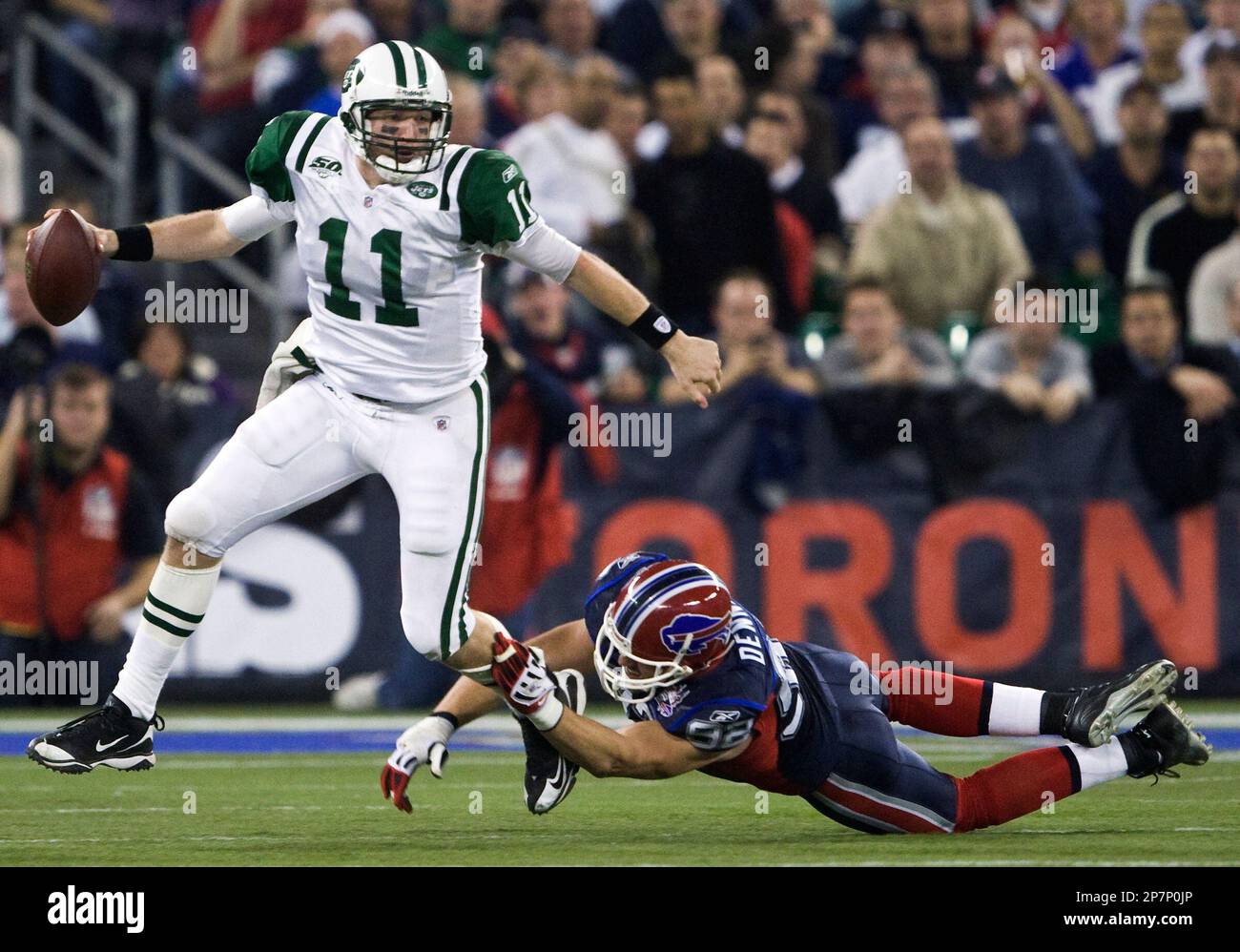 Buffalo Bills Ryan Denney, right, tries to tackle New York Jets ...