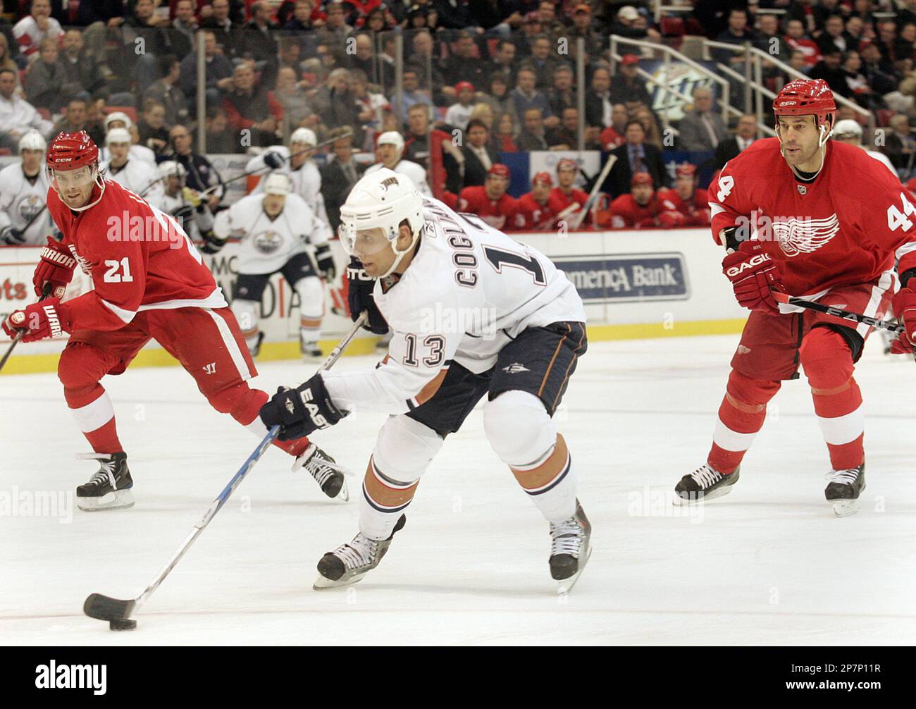 Edmonton Oilers' Andrew Cogliano (13) pushes toward the goal after ...