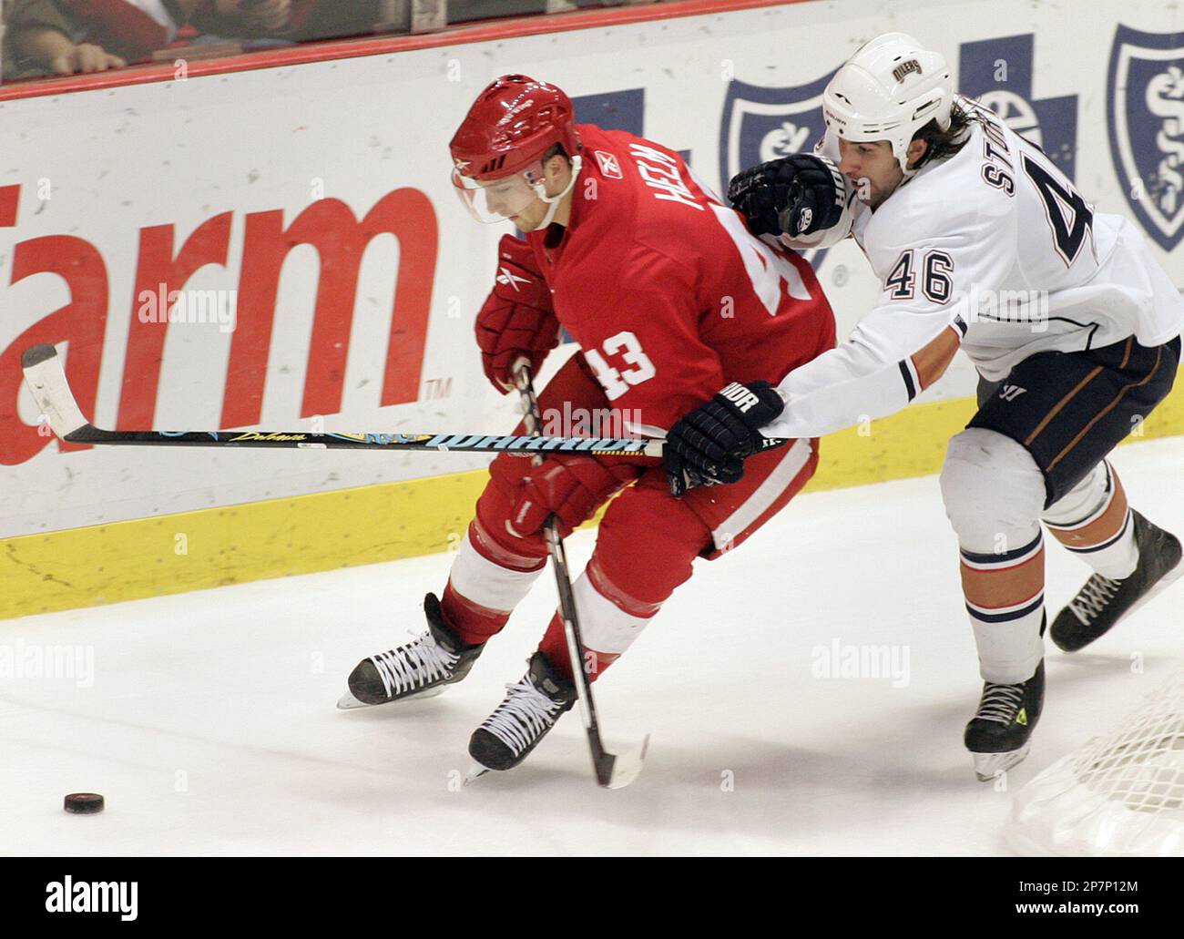 Edmonton Oilers' Zack Stortini (46) tries to take the puck away from ...
