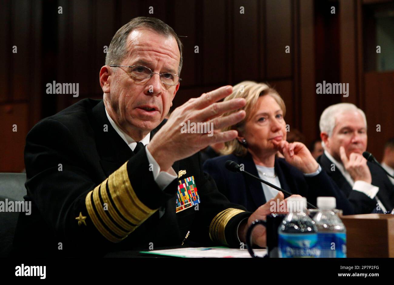 Joint Chiefs Chairman Adm. Michael Mullen, left, accompanied by ...