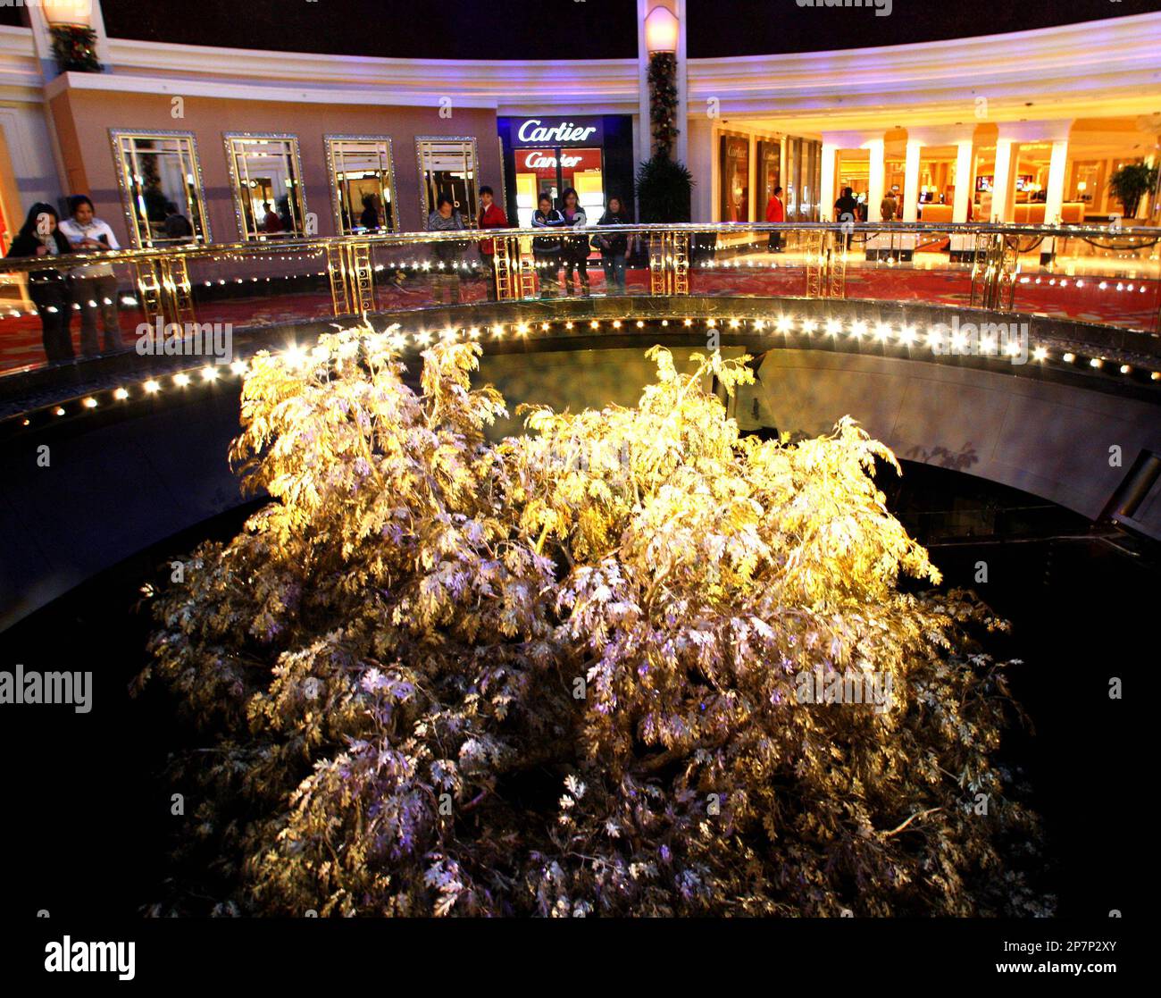 Tourists look at the Gold Tree inside the Macao Wynn Casino of Las ...
