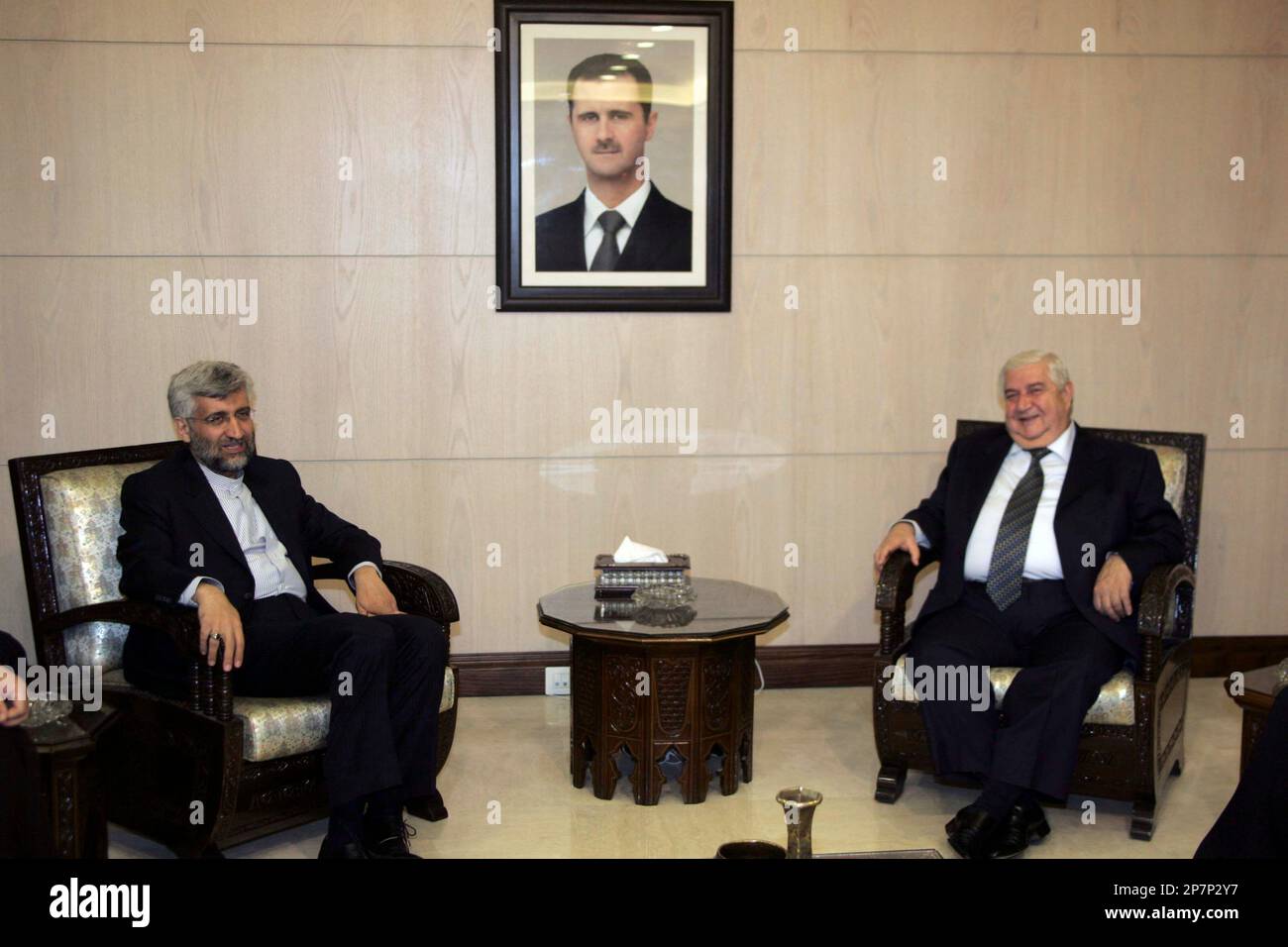 Syrian Foreign Minister Walid al-Moallem, right, meets with Iranian ...