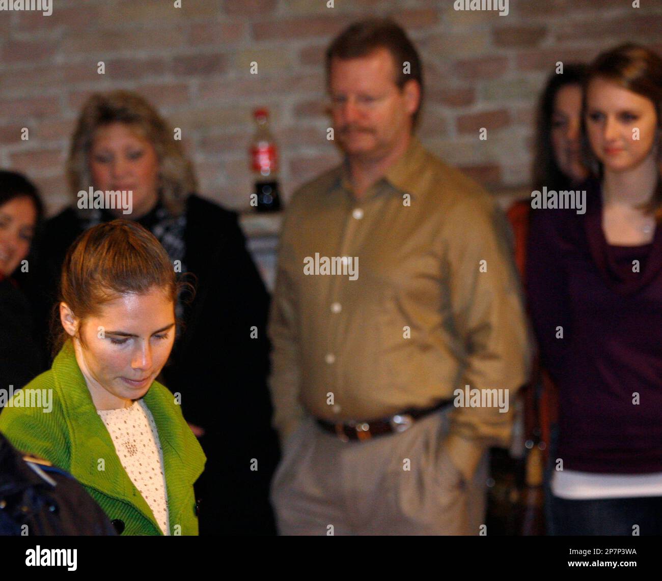 U.S. murder suspect Amanda Knox, bottom left, arrives at the court in ...