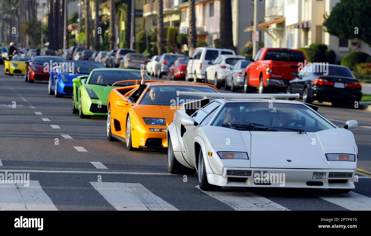 A white 1986 Lamborghini Countach joins a convoy of 30 Lamborghinis ...