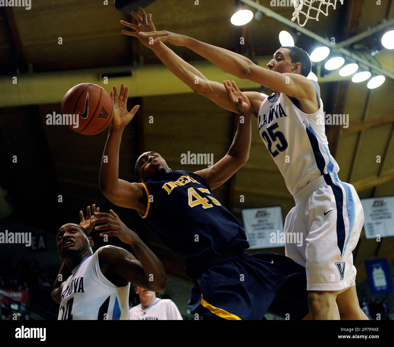 Drexel's forward Samme Givens (45) loses the ball between Villanova's ...