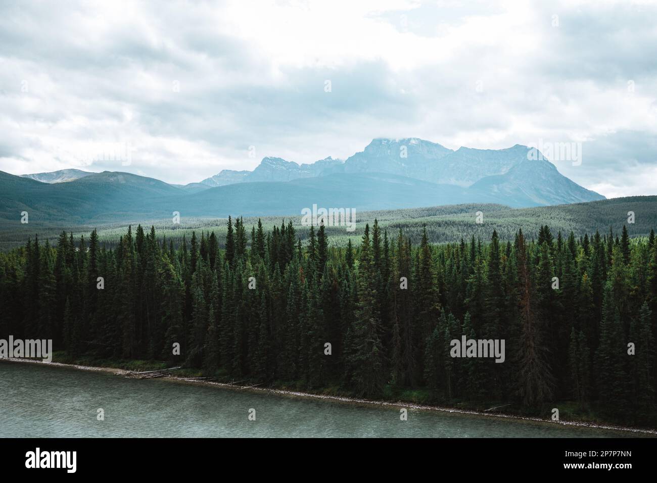 Morant's Curve: Bow River flows through forest and railway track. Storm ...