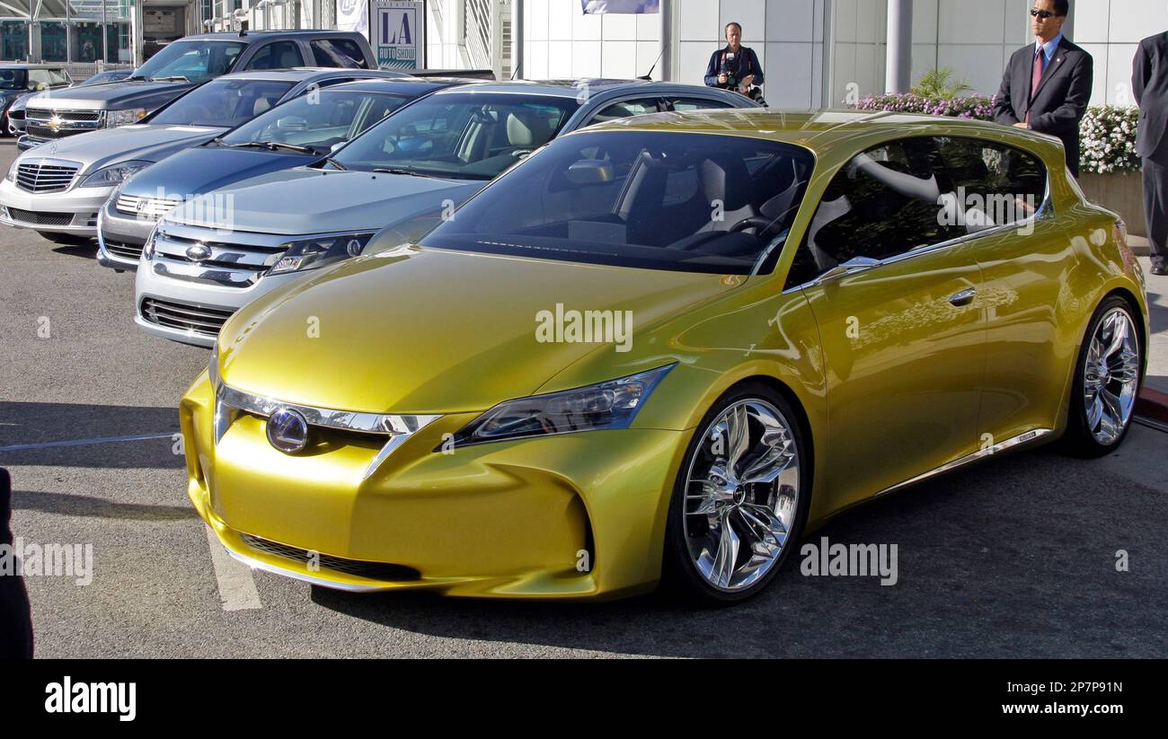A Lexus LF-Ch Premium Compact Hybrid Concept car fronts a lineup of ...