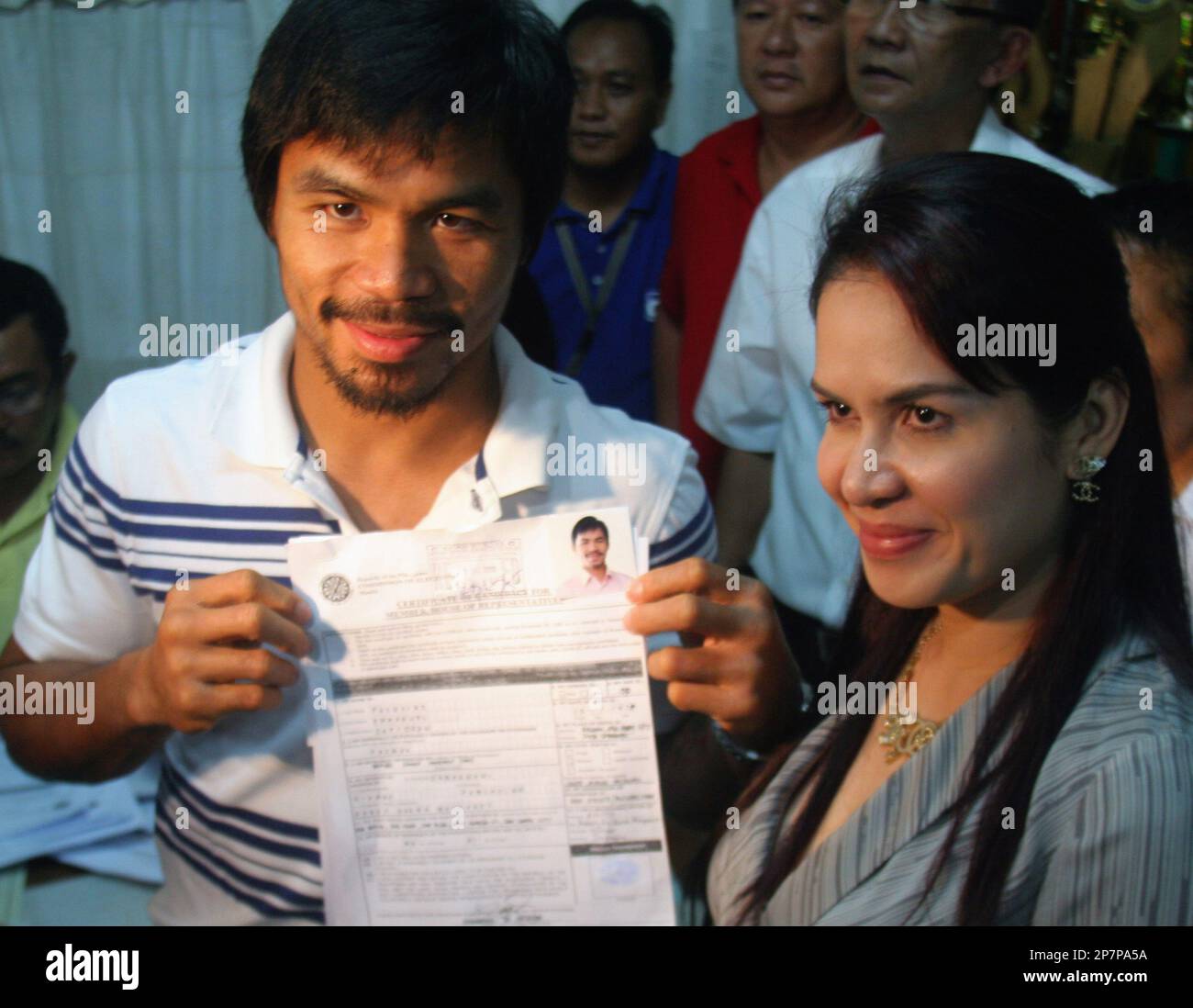 Philippine boxing hero Manny Pacquiao, left, stands beside wife Jinky ...