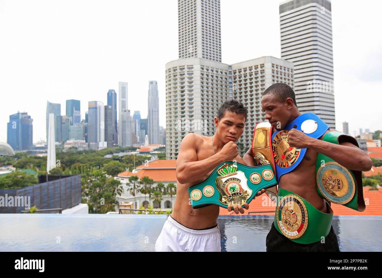 World ranked no. 6, boxer Leon Moore of Guyana, right, poses with Indonesia's boxer Marangin ...