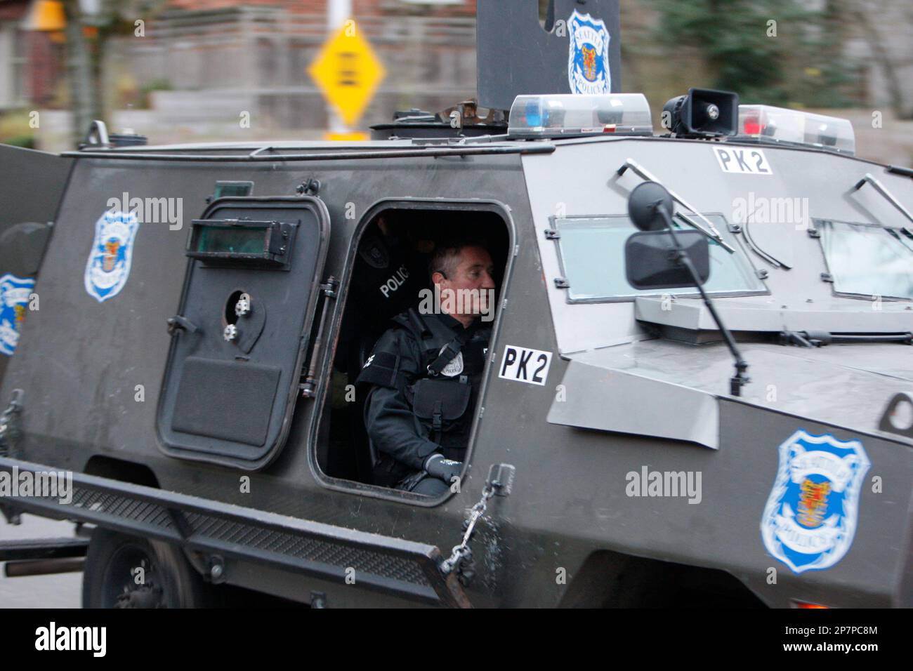Seattle Police dept. SWAT team members leave in their vehicle from the ...