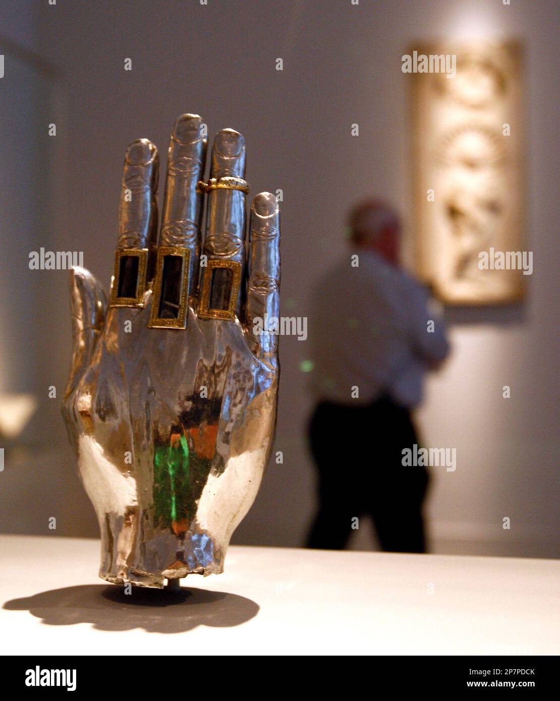 A reliquary in the shape of a hand from around 1250-1300 is seen on ...
