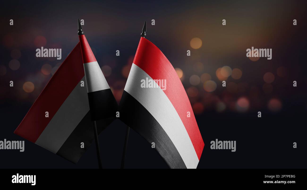Small flags of the Yemen on an abstract blurry background Stock Photo ...