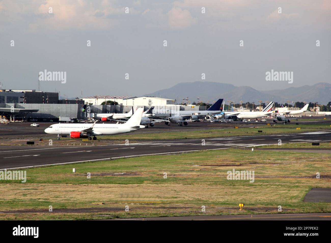 Airplane on runway getting ready for take off or parking Stock Photo ...