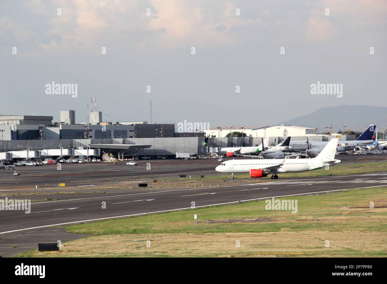 Airplane on runway getting ready for take off or parking Stock Photo ...