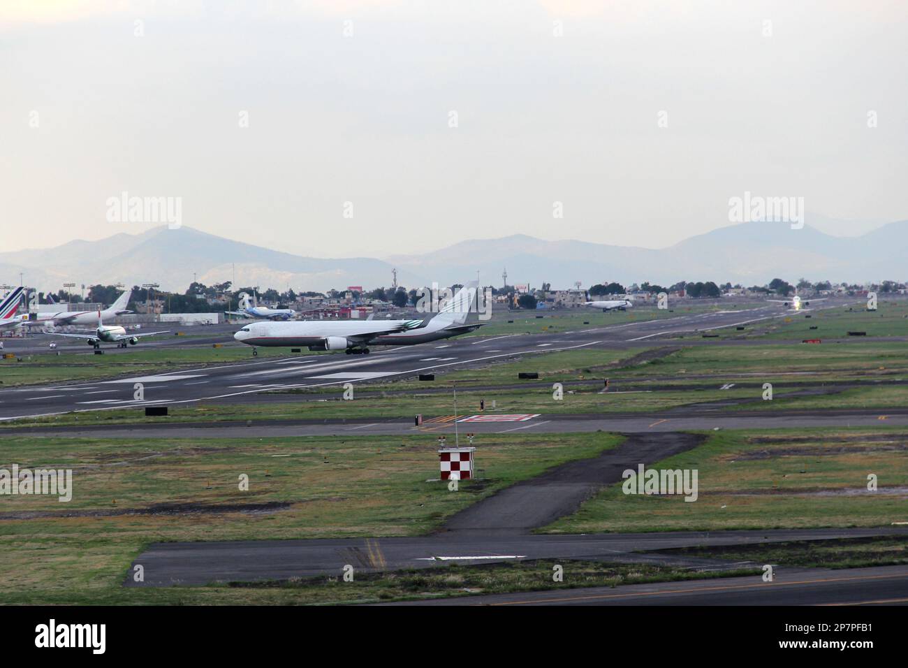 Airplane on runway getting ready for take off or parking Stock Photo ...