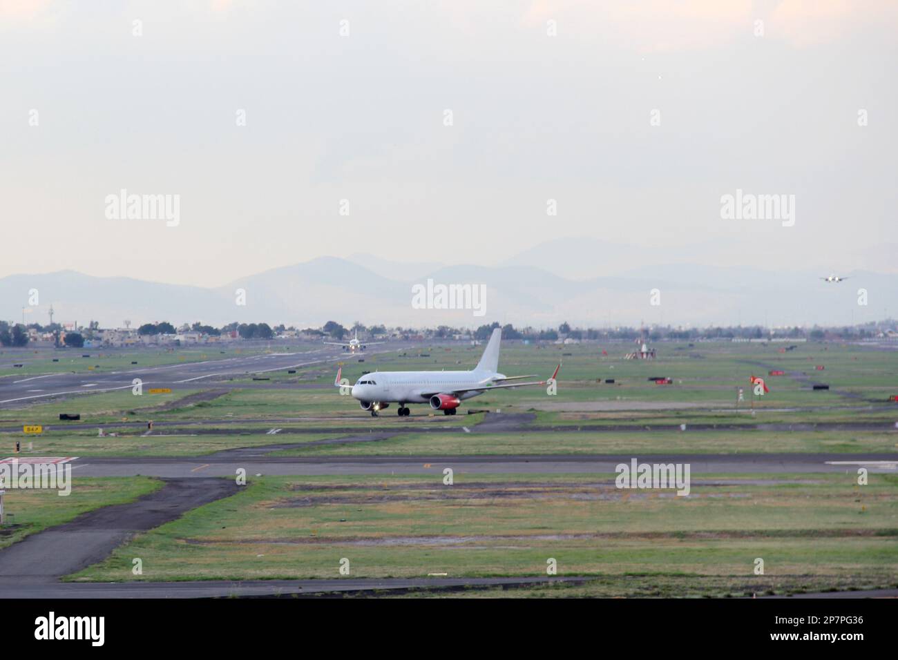 Airplane on runway getting ready for take off or parking Stock Photo ...