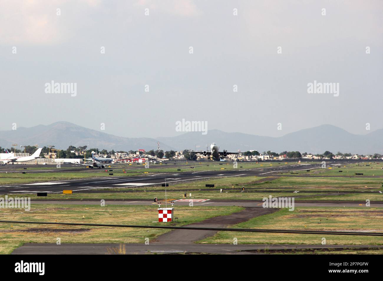Airplane on runway getting ready for take off or parking Stock Photo ...