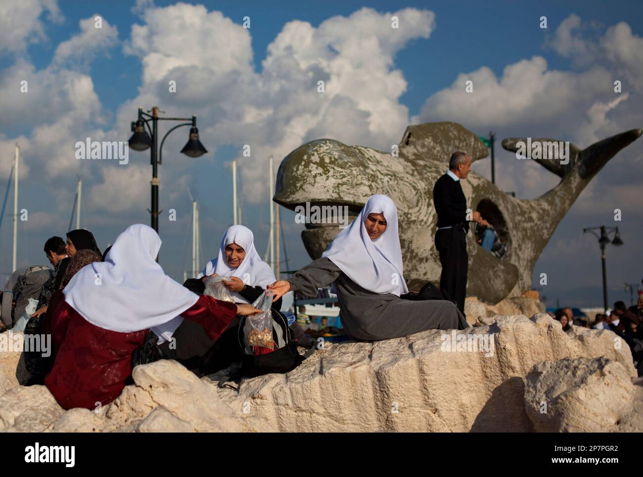 Palestinians enjoy an Eid al-Adha festival at the port of the old city ...