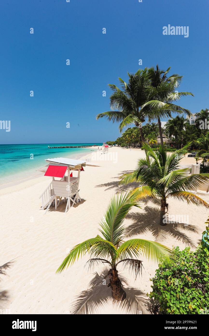The beautiful blue waters and white sand beaches of Doctor's Cave Beach ...