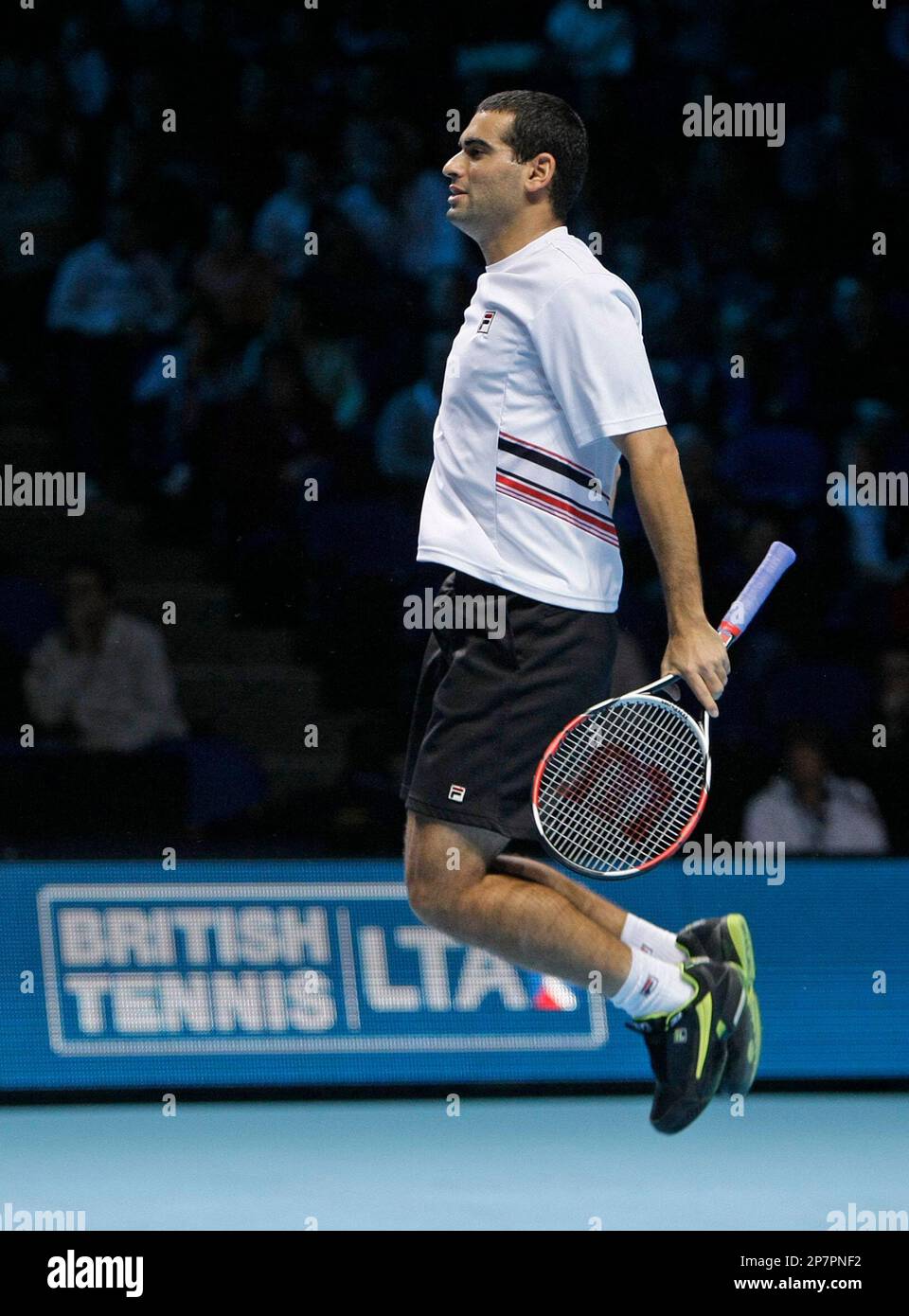 Israel's Andy Ram jumps in the air as he plays Frantisek Cermak of the ...