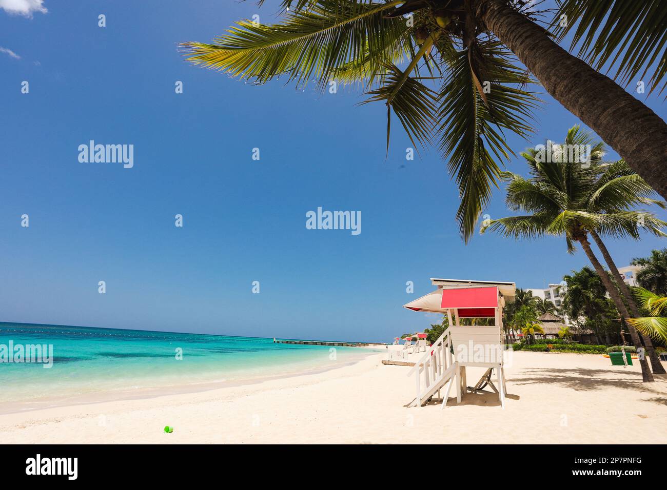 The beautiful blue waters and white sand beaches of Doctor's Cave Beach ...