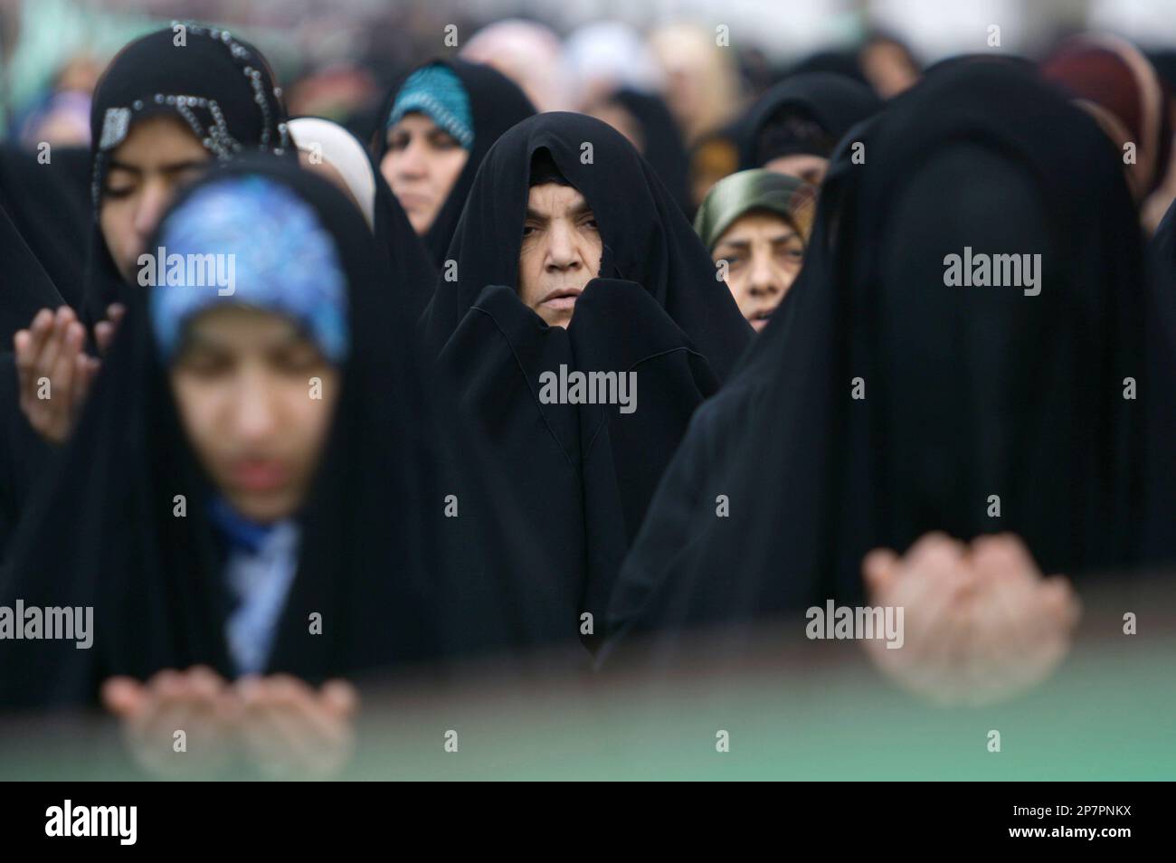Iraqi Shiite Muslim women pray during an Eid al-Adha prayer, outside ...